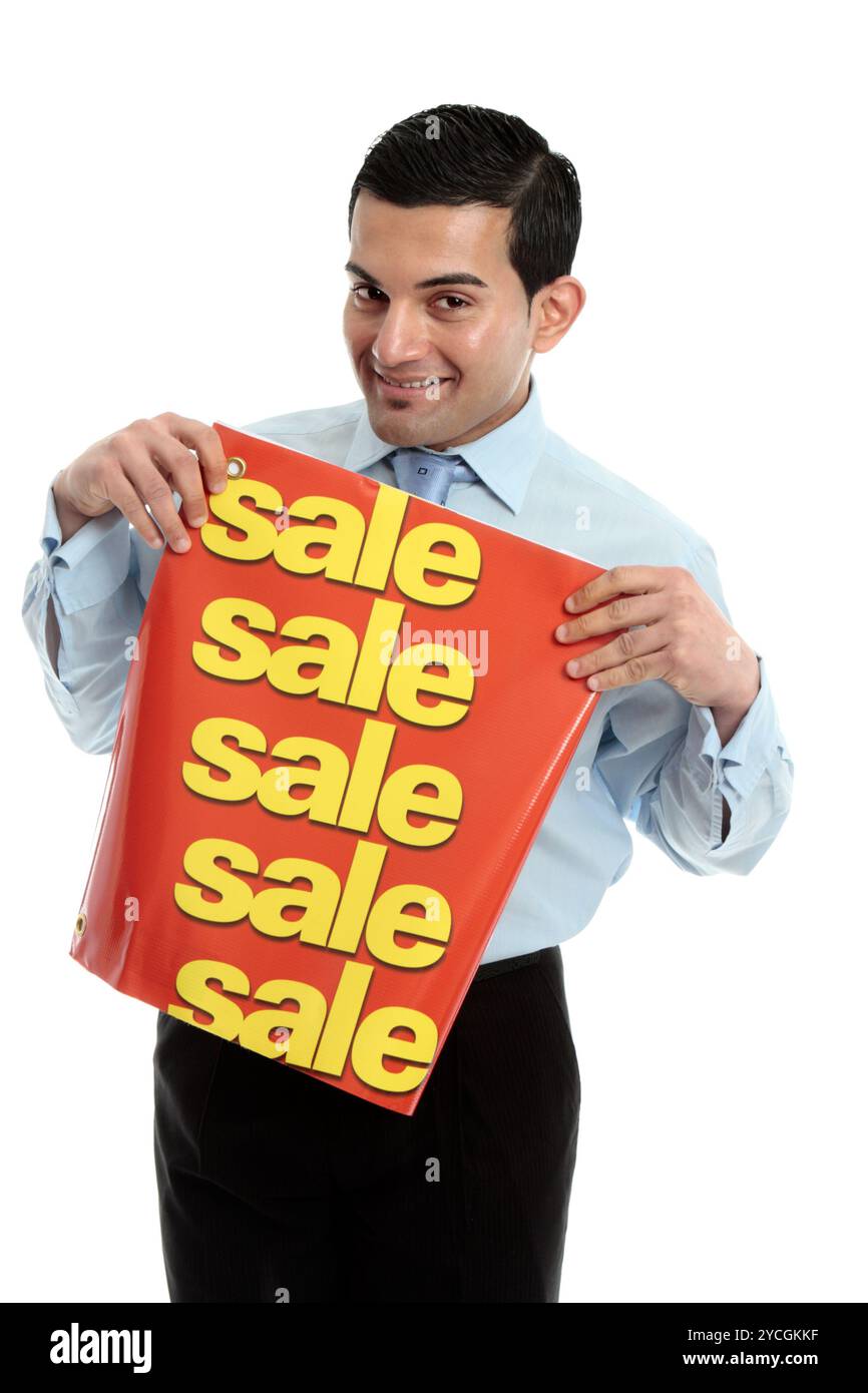 Retail salesman holding a sale sign banner Stock Photo - Alamy
