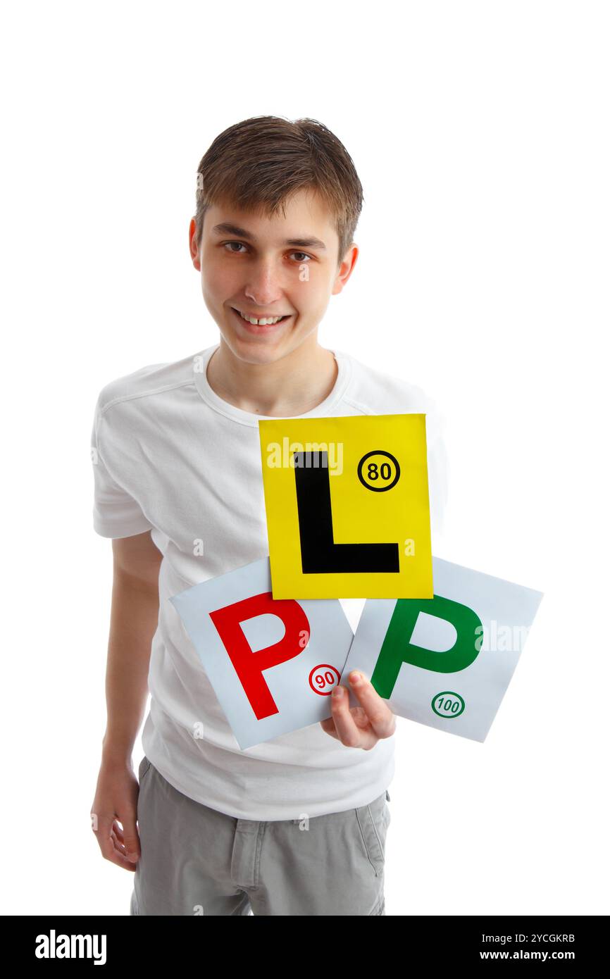 Teen holding magnetic driving licence plates for car Stock Photo - Alamy