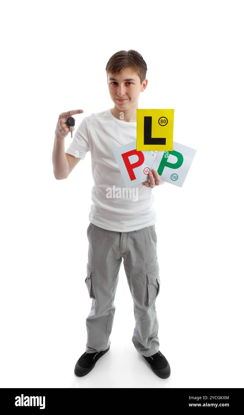 Teenager holding car key and learner licence plates Stock Photo - Alamy