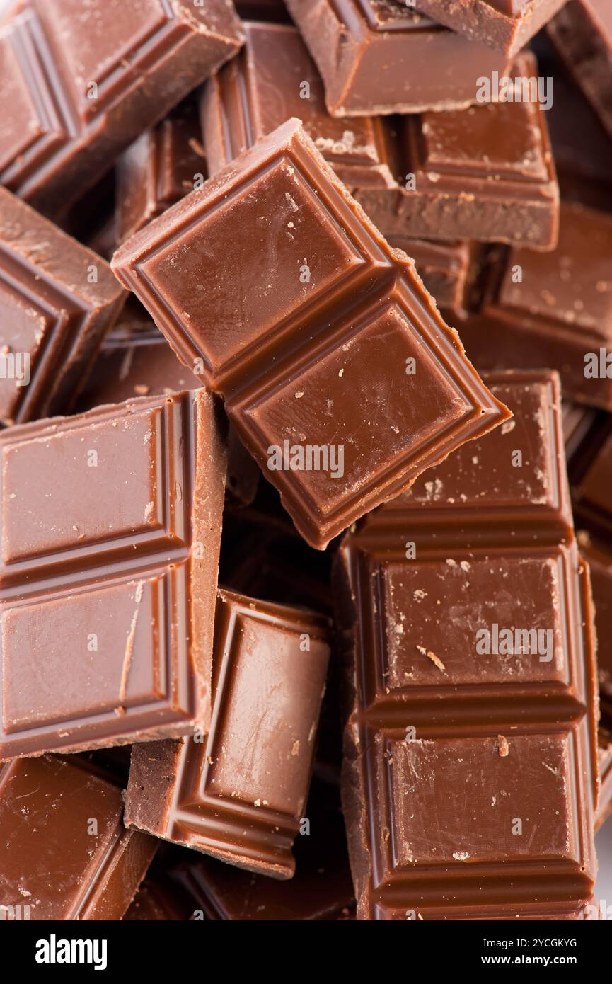 Broken chocolate background Stock Photo - Alamy