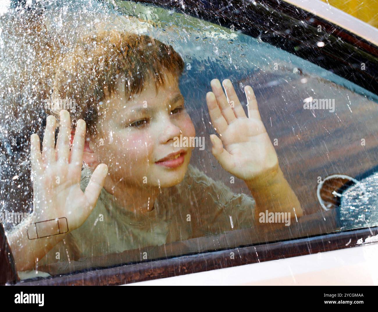 Child and window on a wet rainy day Stock Photo - Alamy