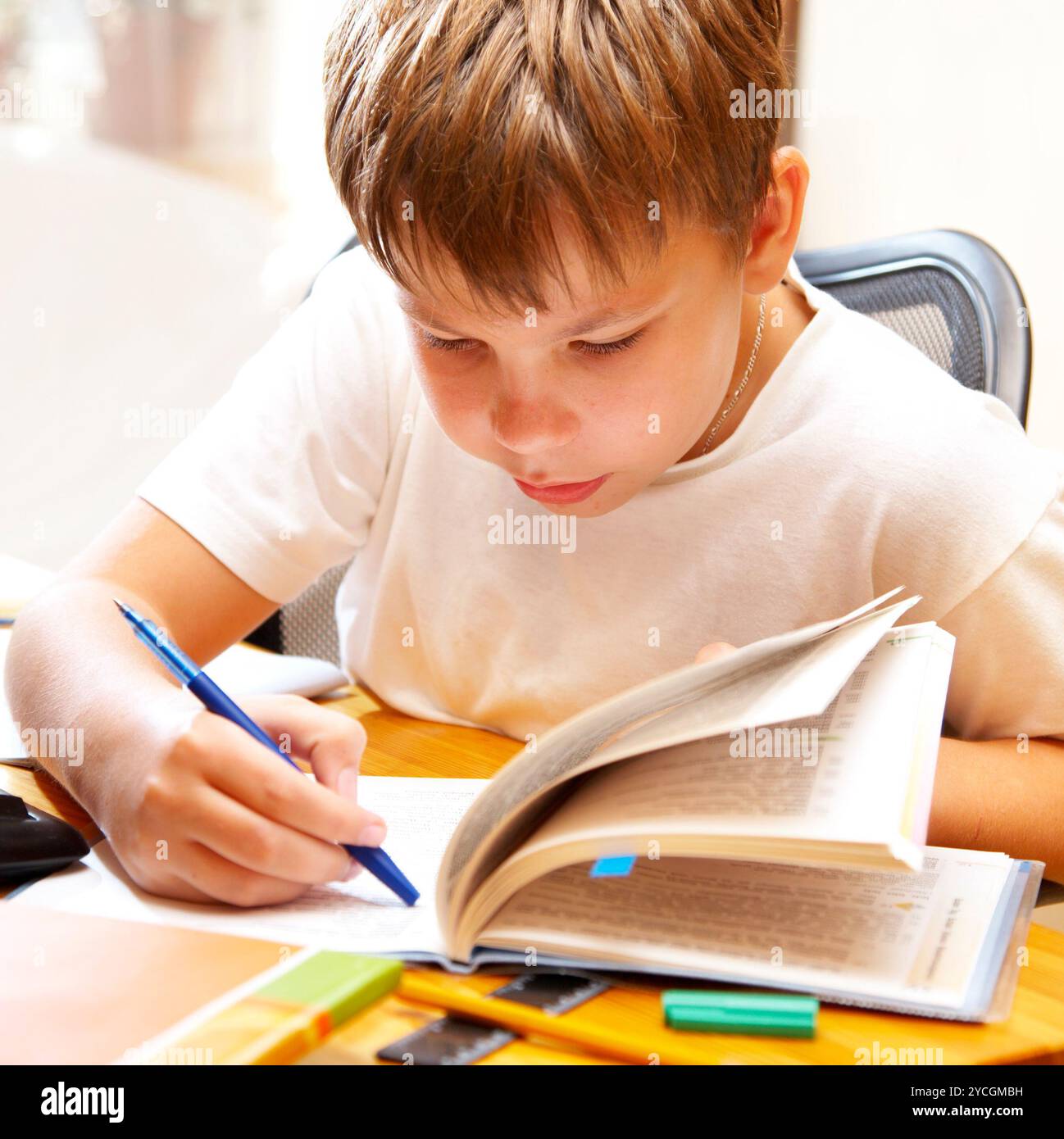 Boy behind a desk Stock Photo - Alamy