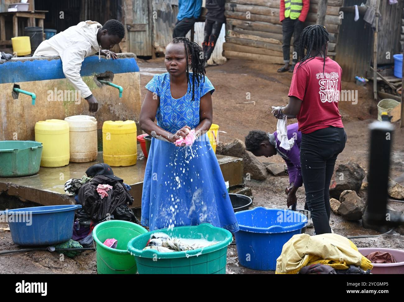 NAIROBI SLUM KIBERA, KENYA, AFRICA - NOVEMBER 18, 2022: Women do ...