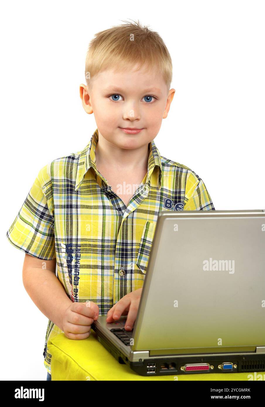 The boy the blonde is engaged with a computer Stock Photo - Alamy
