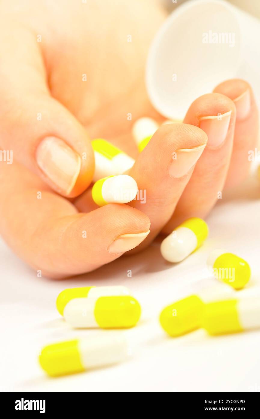 Female hand with tablets Stock Photo - Alamy