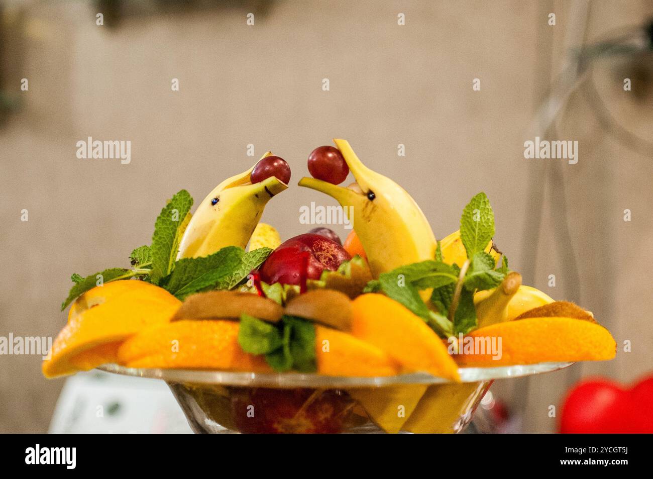 Whimsical Fruit Arrangement Featuring Playful Banana Animals and Fresh ...