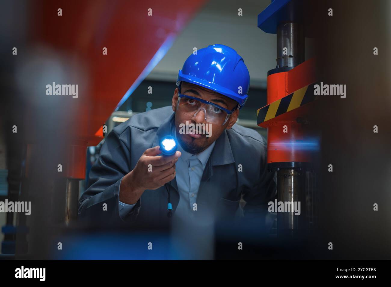 African American engineering technology professional holding a ...