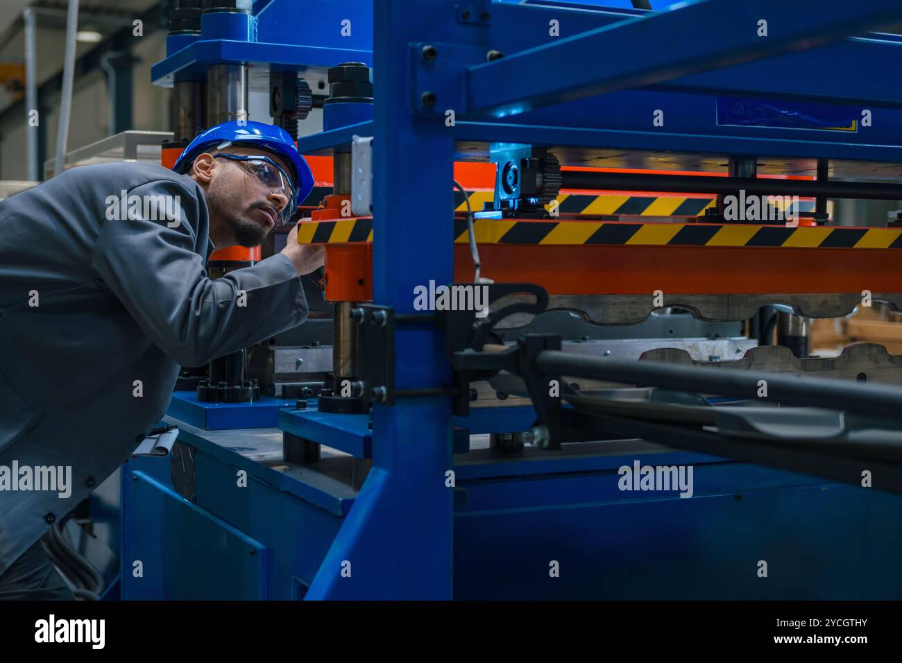 African American engineering technology professional holding a ...