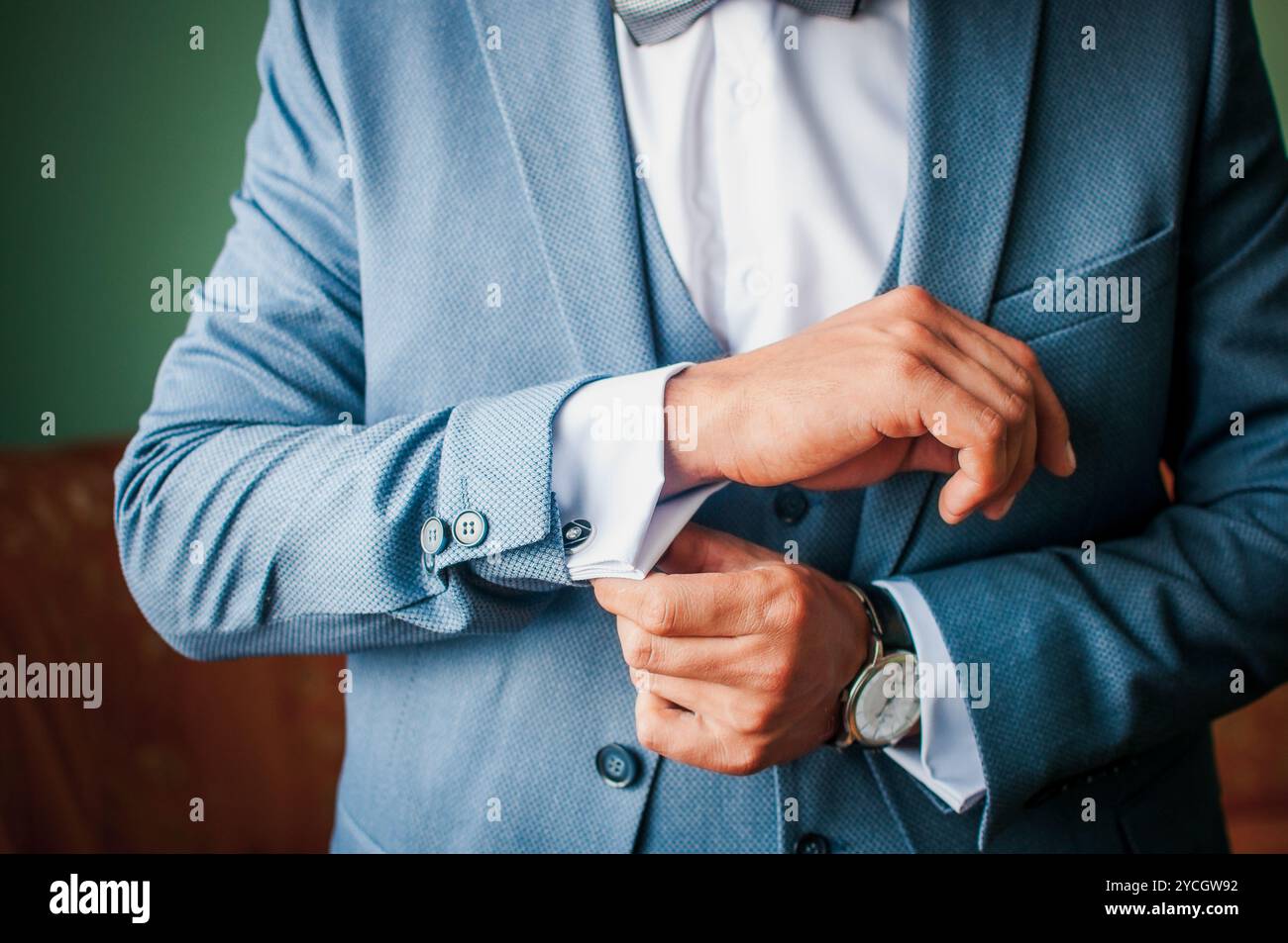 Elegant Groom Adjusting Cufflinks in Formal Attire Stock Photo - Alamy