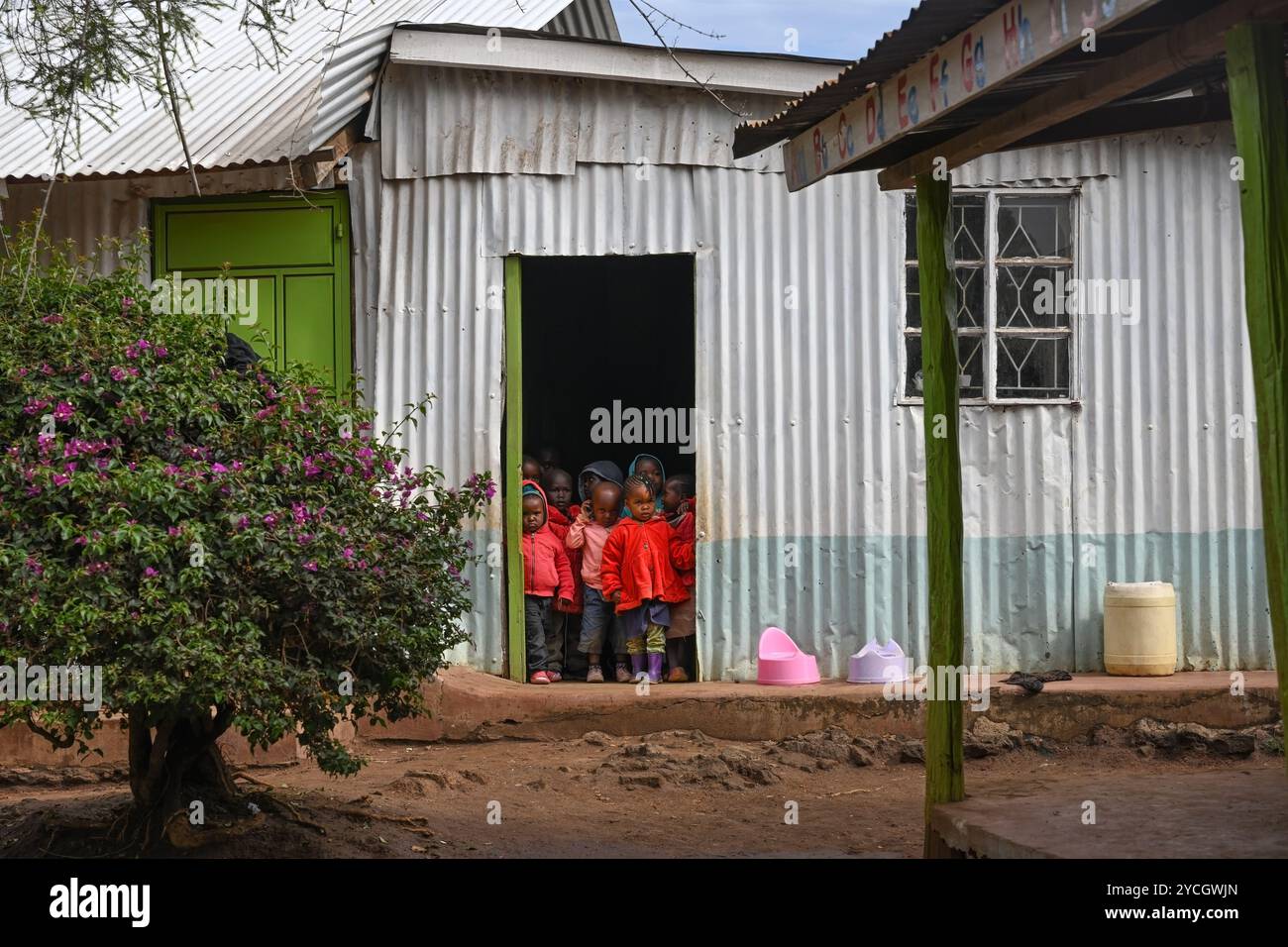 SLUM OF NAIROBI, KENYA - NOVEMBER 18, 2022: Group of African children ...