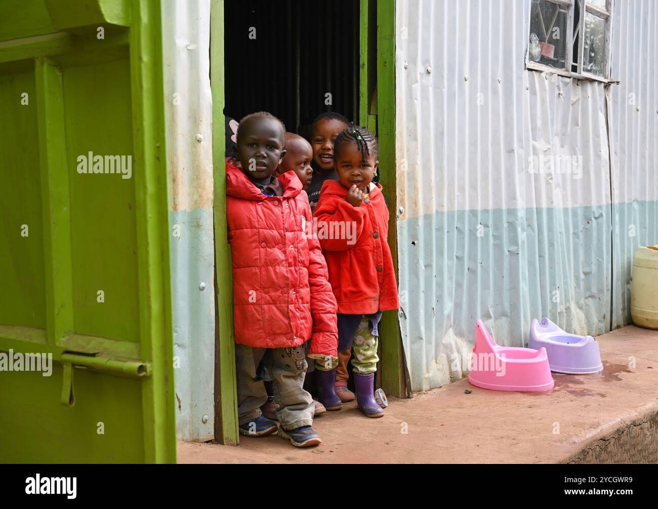 SLUM OF NAIROBI, KENYA - NOVEMBER 18, 2022: Group of African elementary ...