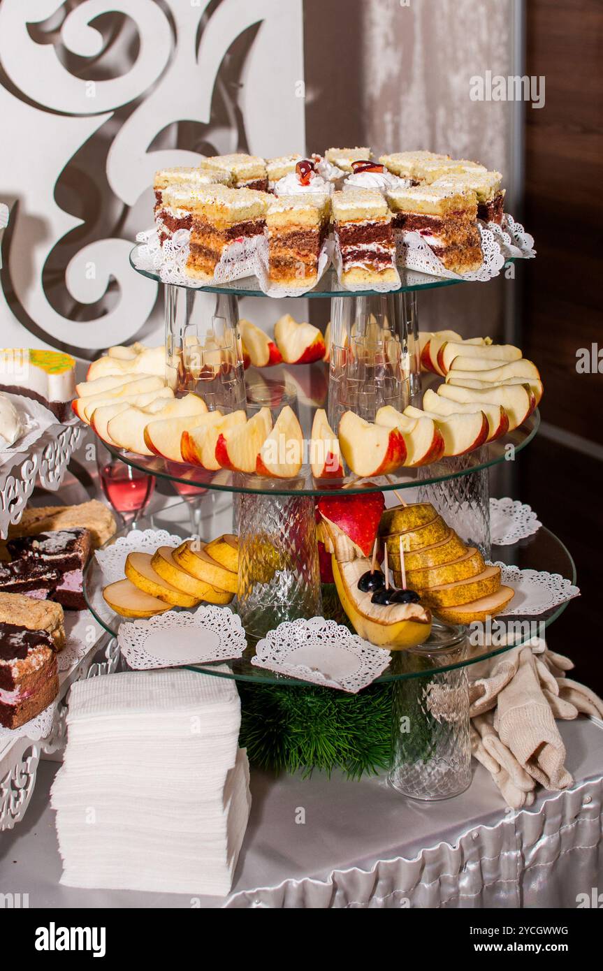Exquisite Tiered Dessert Display Featuring Assorted Cakes and Fruits ...