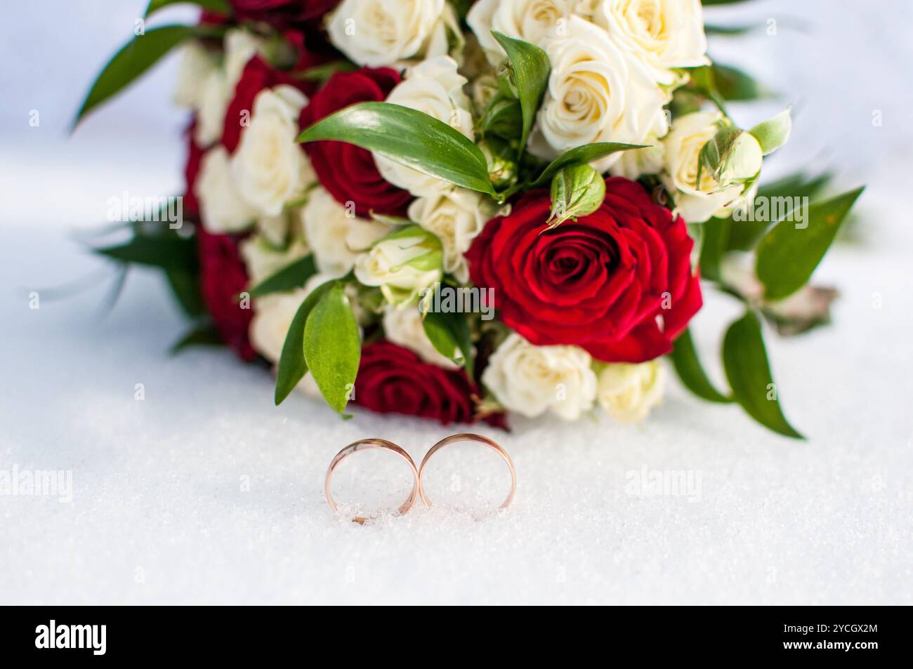 Romantic Engagement Rings Nestled Amidst a Lush Bouquet of Red and ...