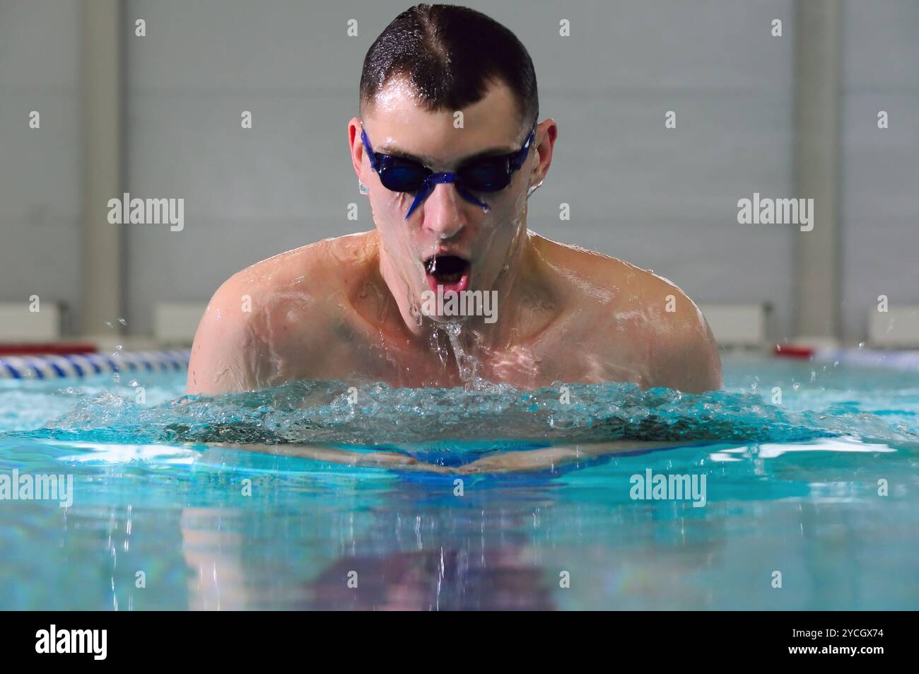 Young man swims breaststroke in hi-res stock photography and images - Alamy