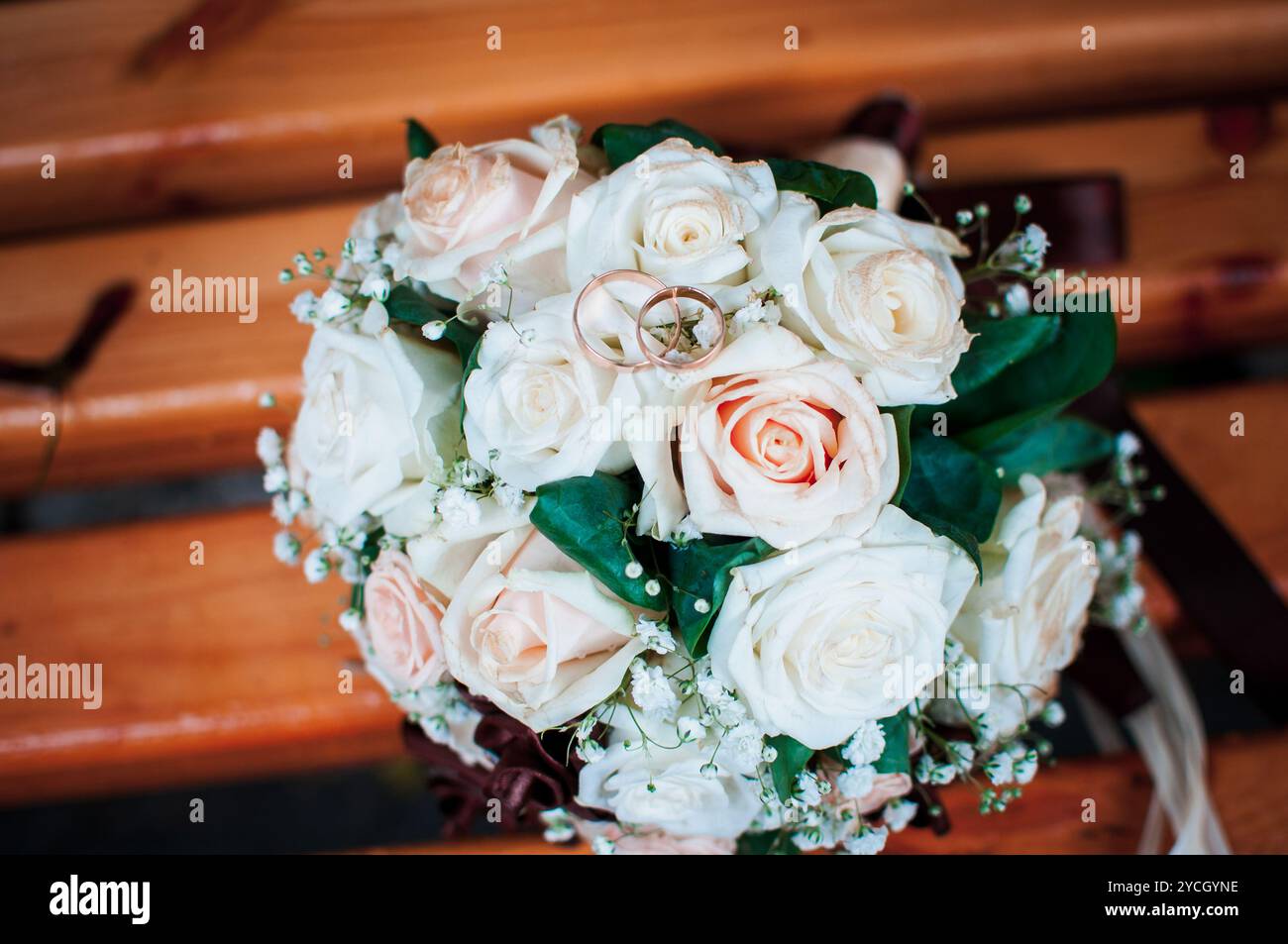 Elegant Wedding Bouquet with Rose Varieties and Rings Stock Photo - Alamy