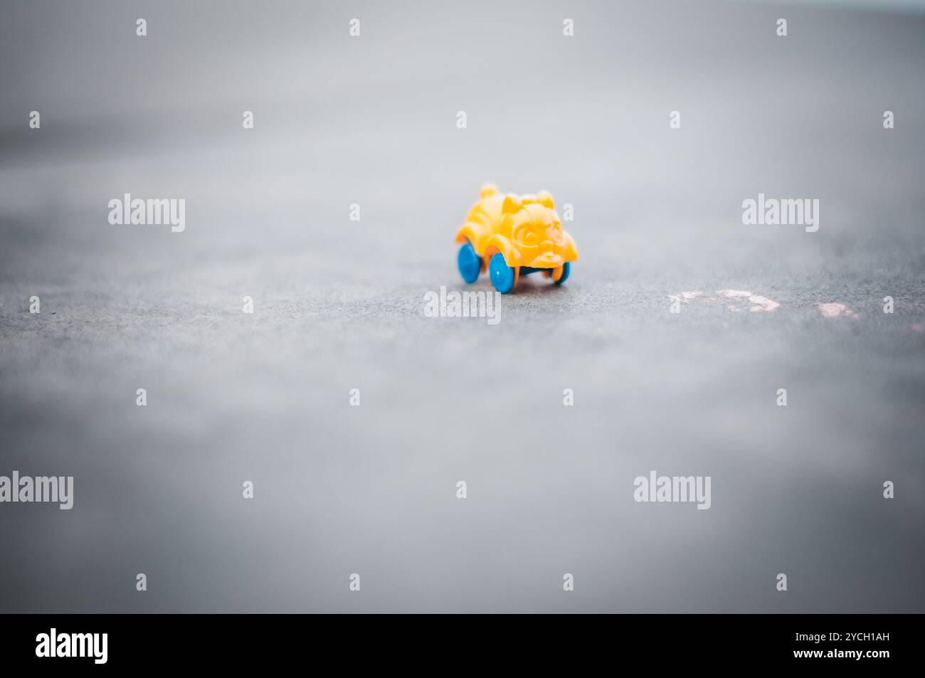 A Charming Little Toy Car on a Gray Surface Stock Photo - Alamy