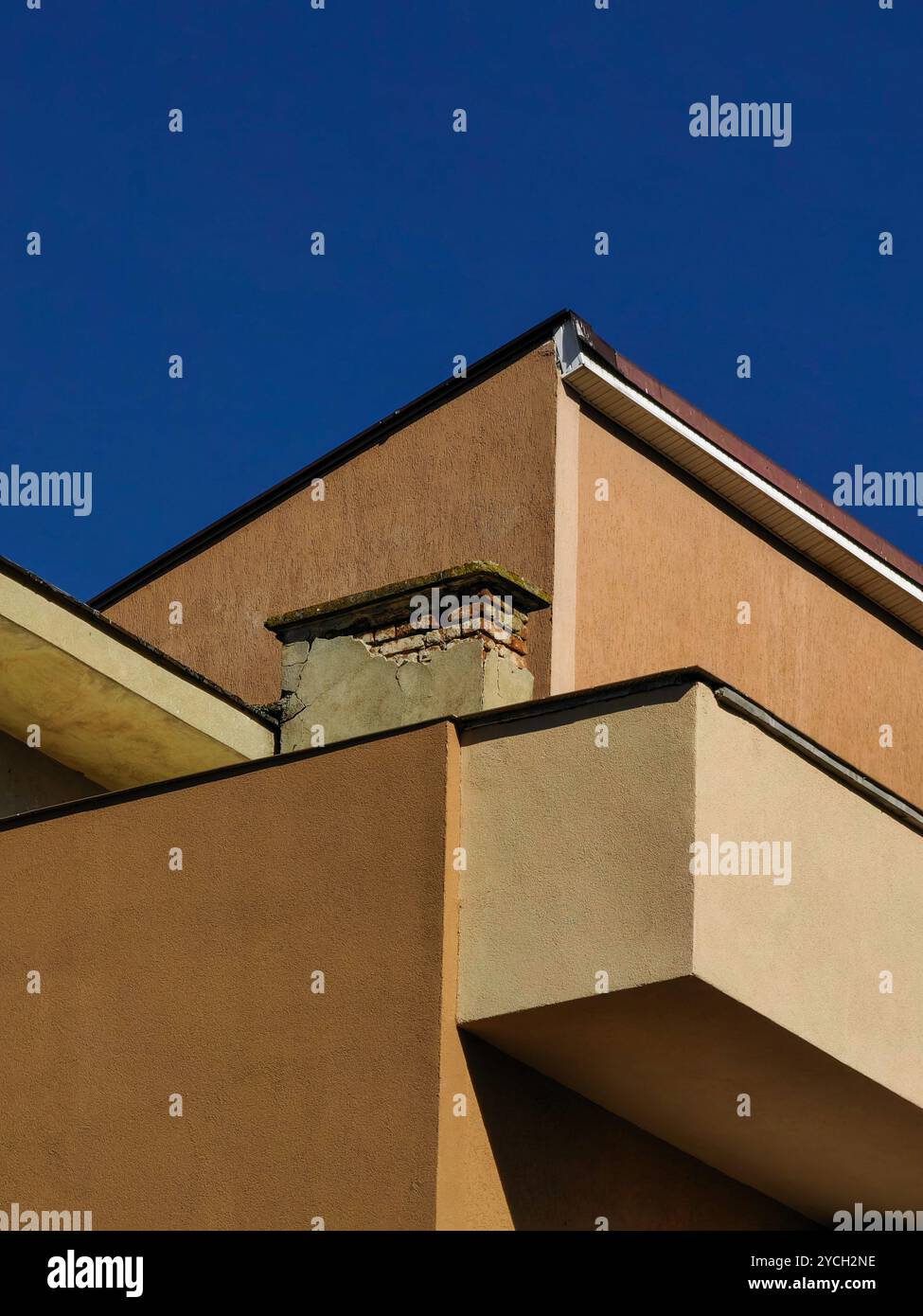 Building Architecture and Rooftop Terrace Against Blue Sky: Low Angle ...