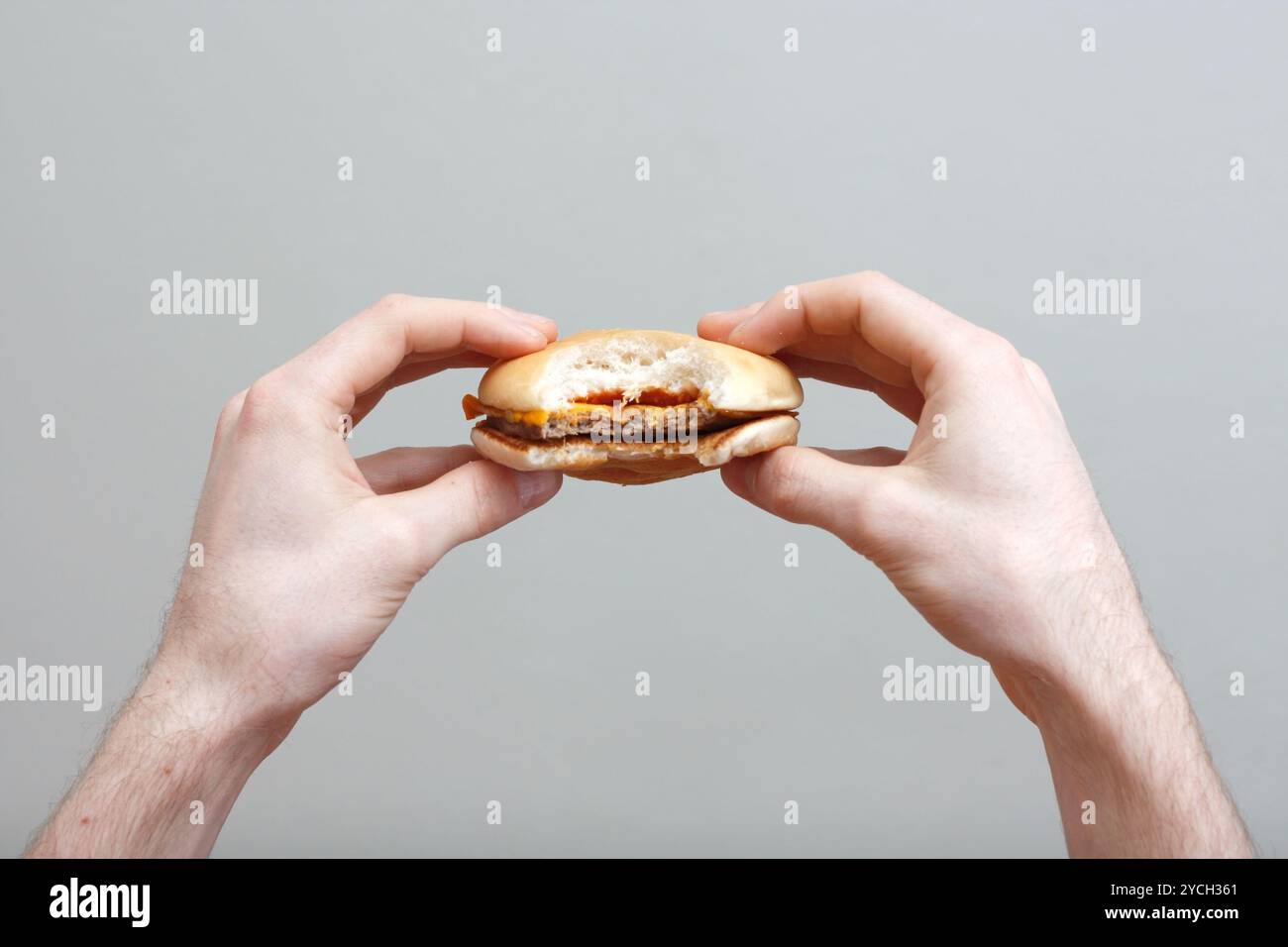 Man eating burger Stock Photo - Alamy
