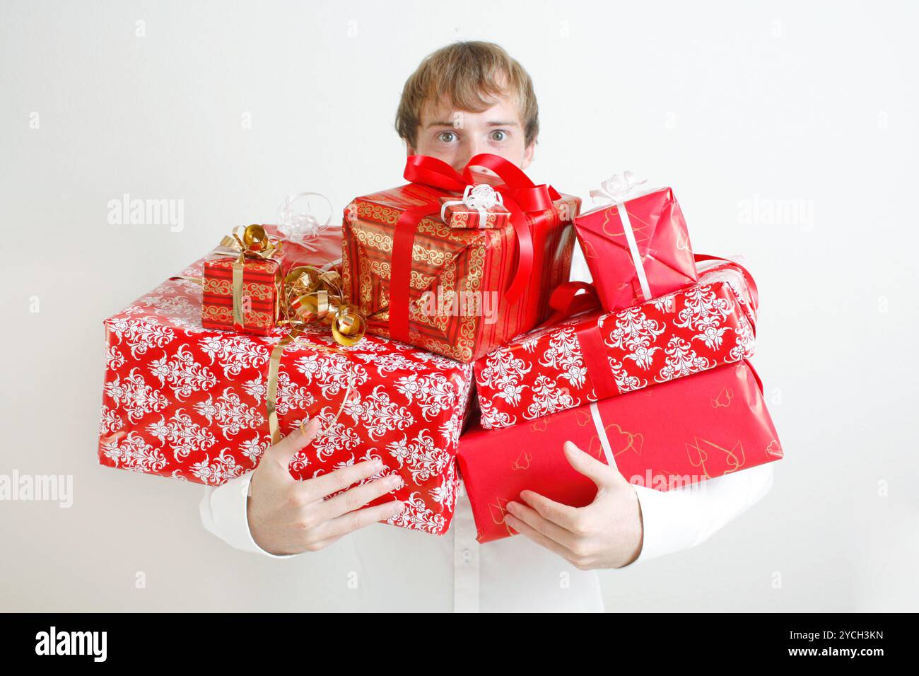 Presenting alot of gifts Stock Photo - Alamy