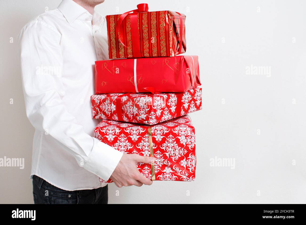 Presenting alot of gifts Stock Photo - Alamy