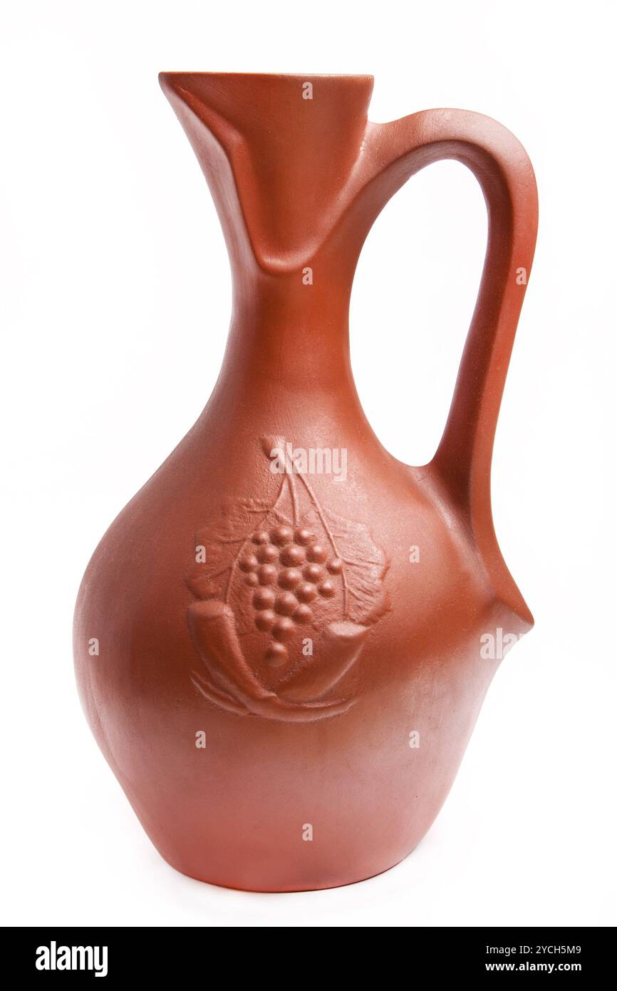 Traditional clay jug for wine on white Stock Photo - Alamy