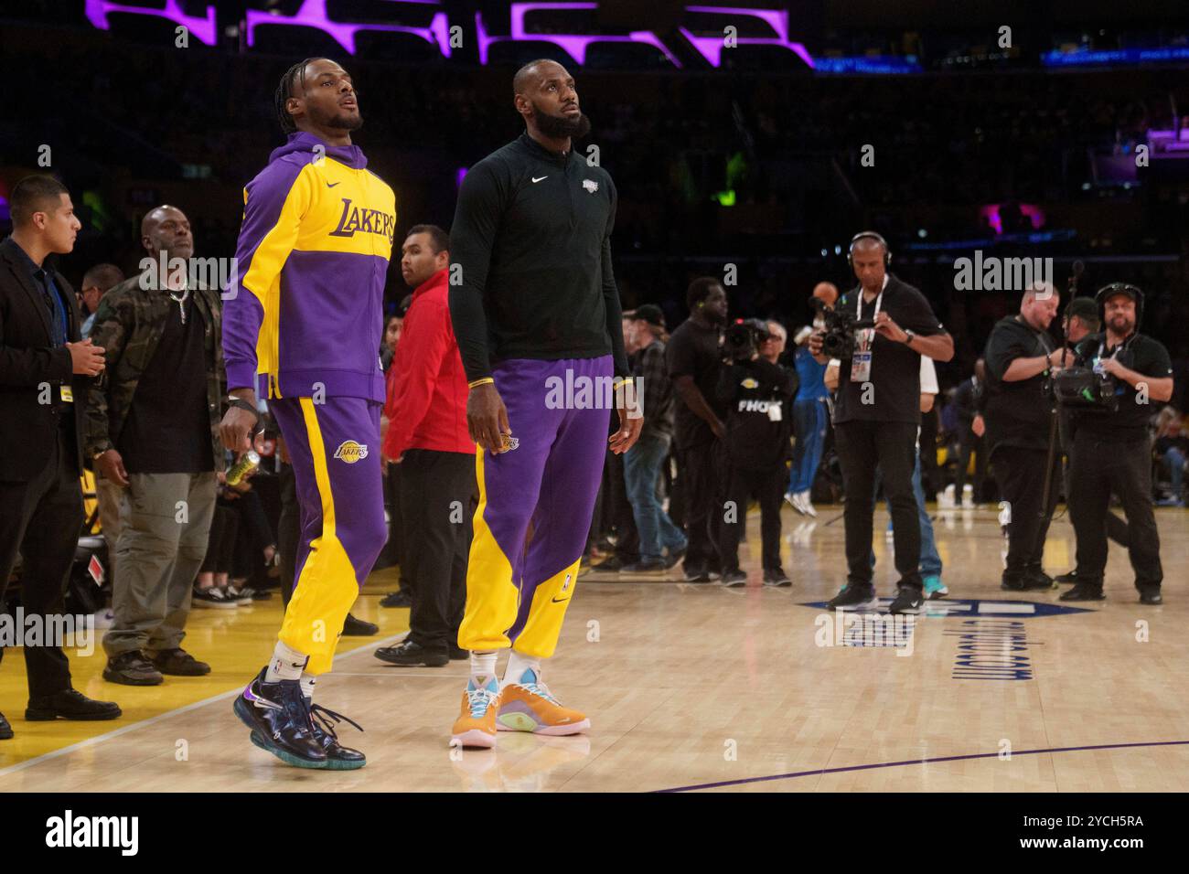 Los Angeles Lakers guard Bronny James, left, and forward LeBron James warm up before an NBA ...