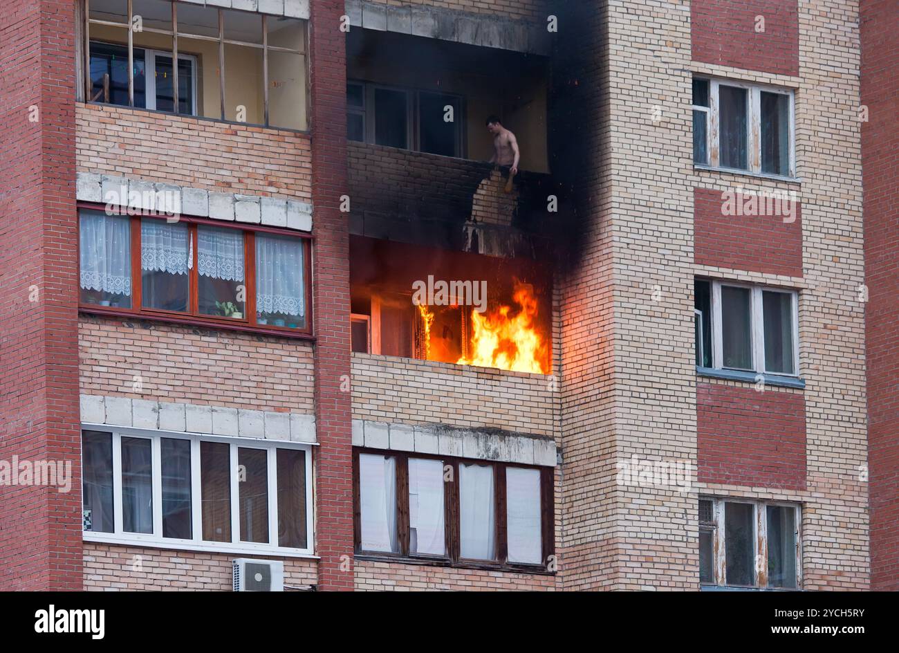 Fire in one of the apartments of a large tenement-house Stock Photo - Alamy
