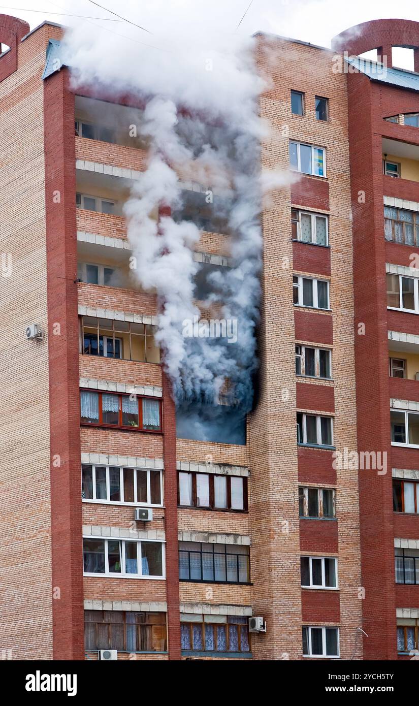 Fire in one of the apartments of a large tenement-house Stock Photo - Alamy