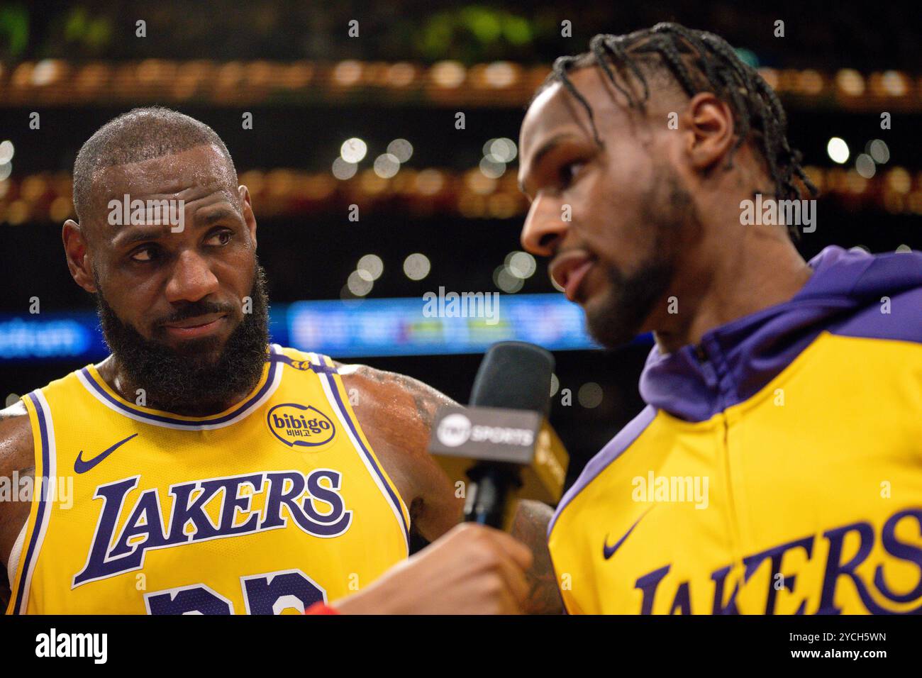 Los Angeles Lakers forward LeBron James, left, listens to guard Bronny ...