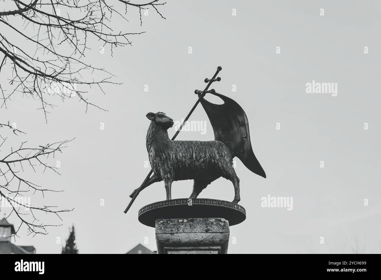 Black and white photo of the Lamb of God statue standing atop a column ...