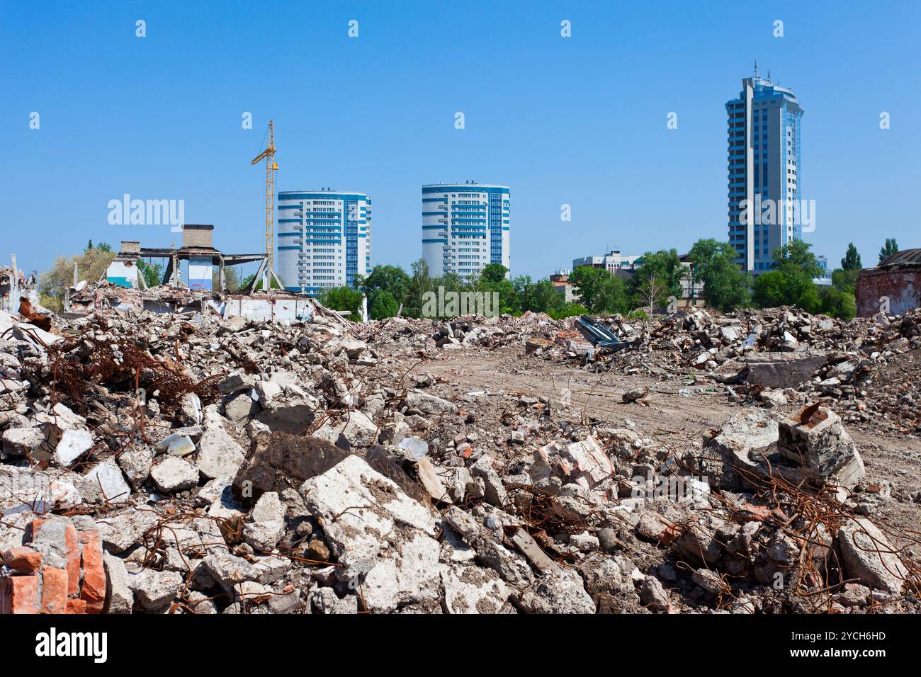Pile of debris of ruined building on new buildings background Stock ...