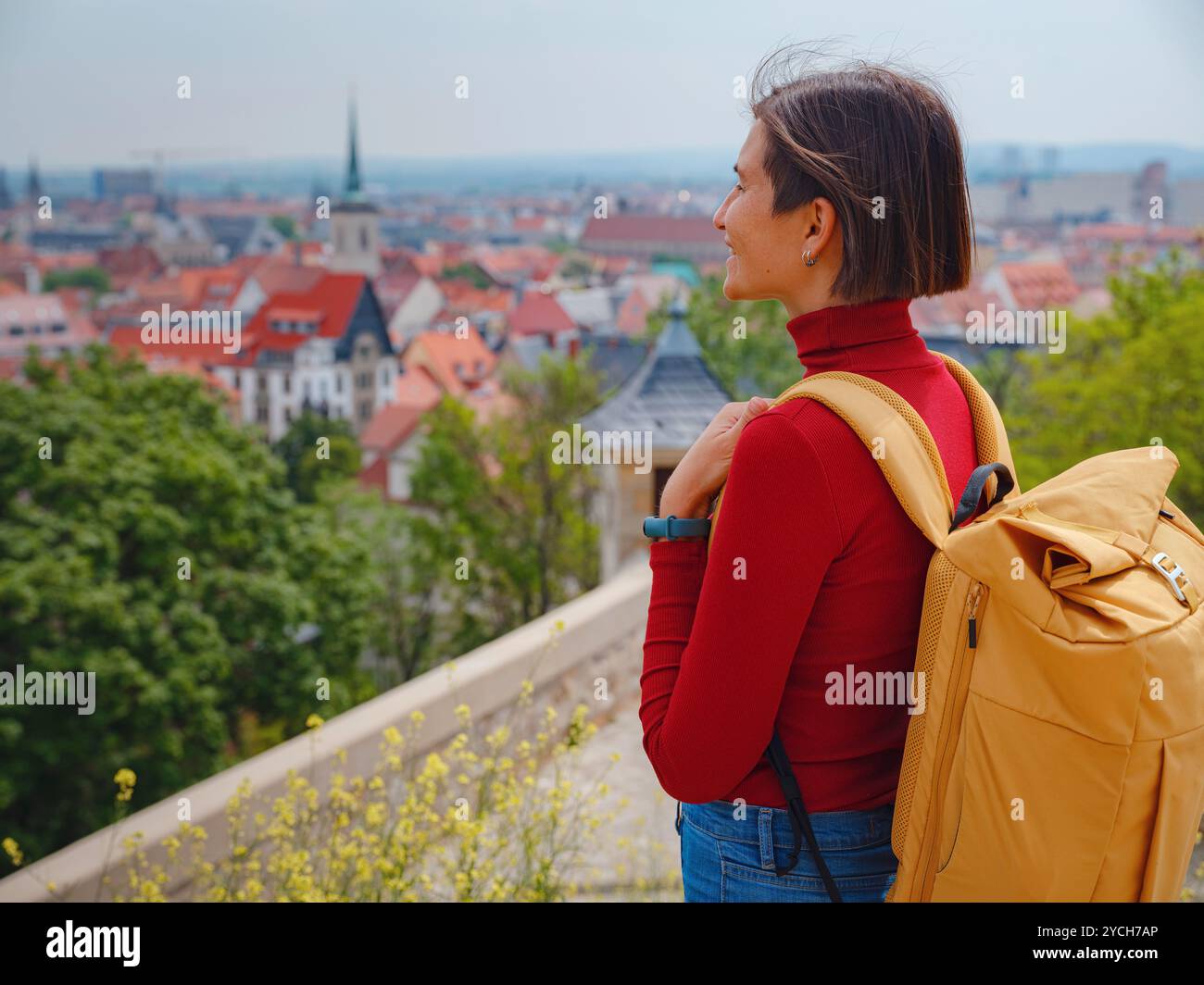 Tourist woman explores beautiful city of Erfurt, wandering through its ...