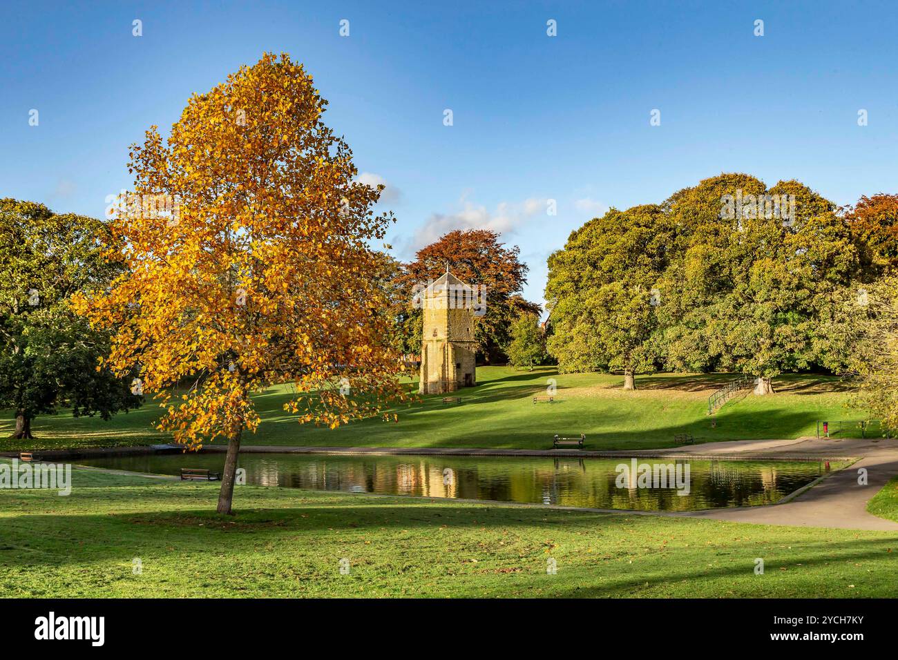 The Pigeon Tower and boating lake in Abington Park, Northampton ...