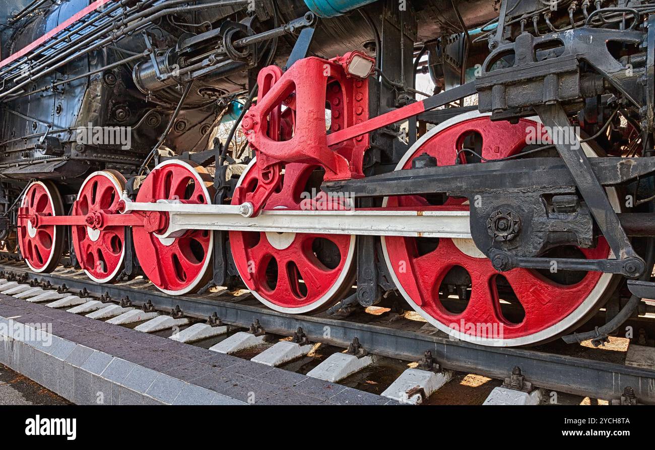 Old steam locomotive engine wheel and rods details Stock Photo - Alamy