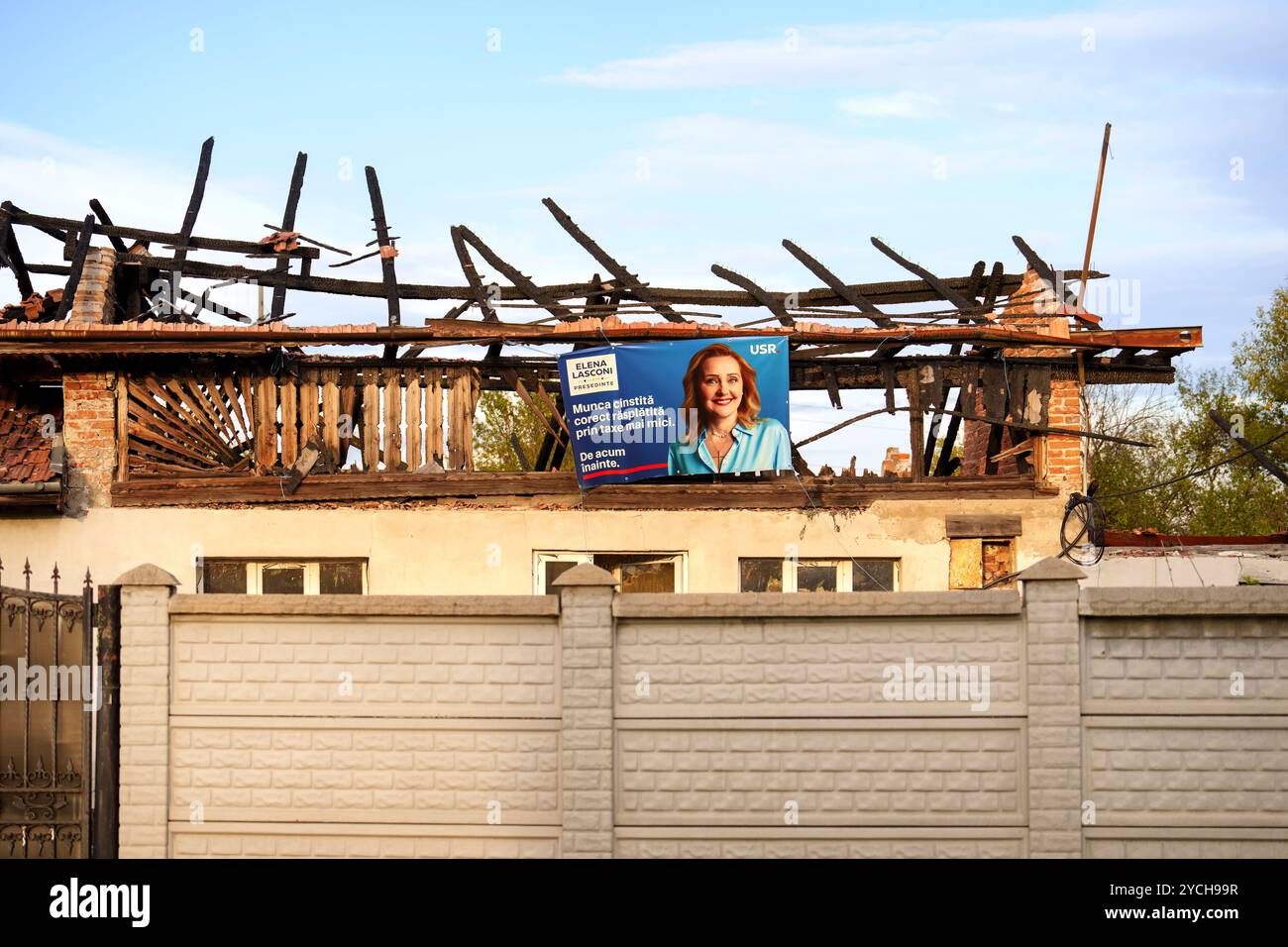 An electoral poster of presidential candidate Elena Lasconi is placed ...