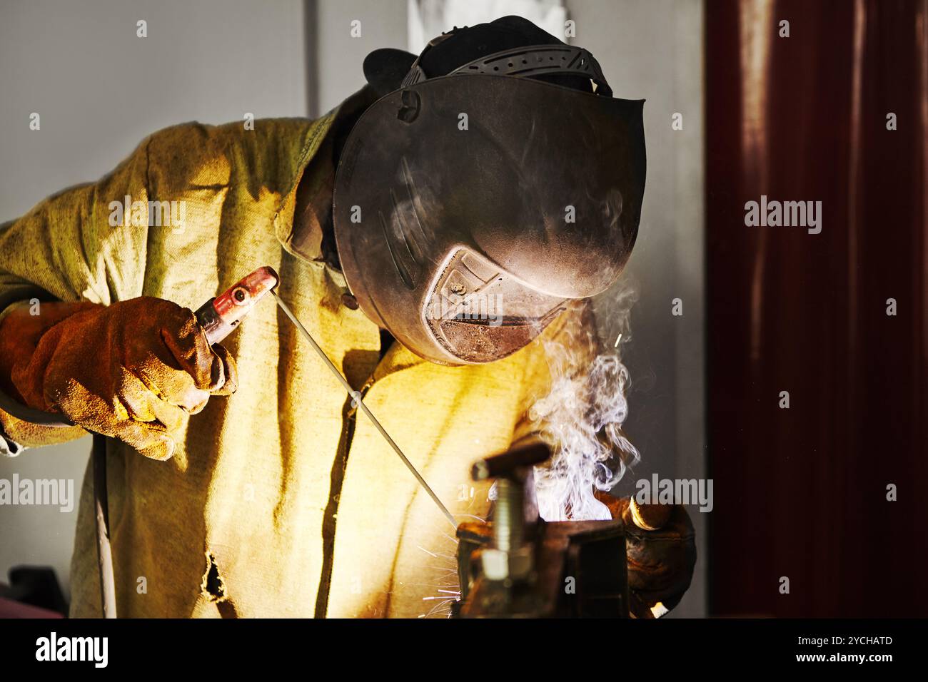 Male in face mask welds with welding Stock Photo - Alamy