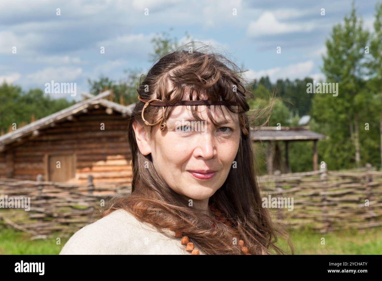 Young women on background of ancient traditional russian village X ...