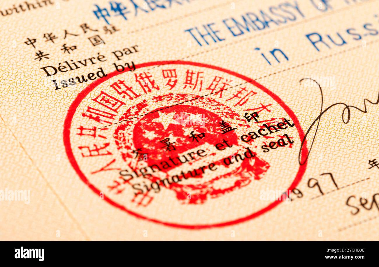 Visa entry and exit stamps in passport Stock Photo - Alamy