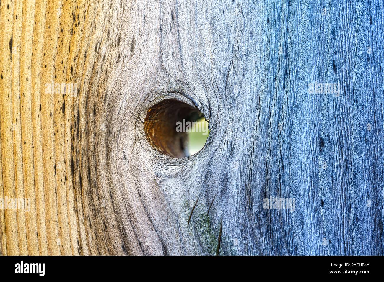 Hole left by a removed knot on a wood plank Stock Photo - Alamy