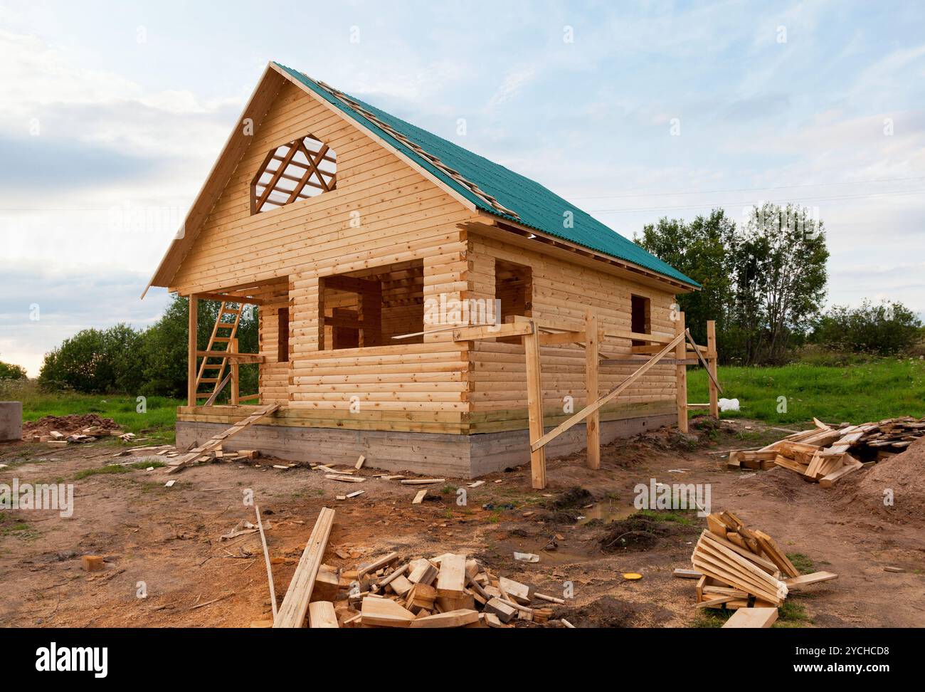 Wooden house under construction Stock Photo - Alamy