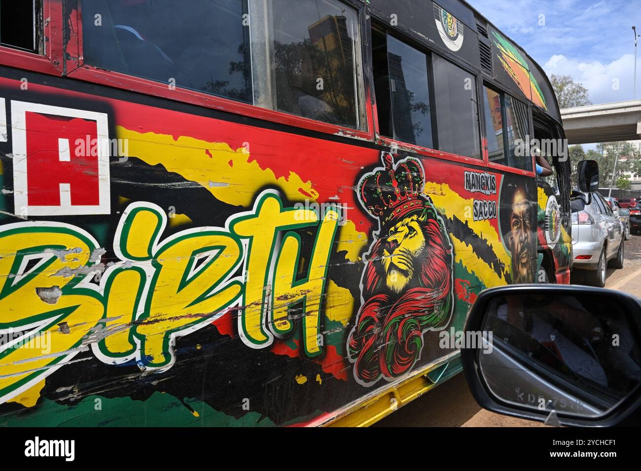 NAIROBI DOWNTOWN, KENYA - NOVEMBER 20, 2022: Painted buses on the ...