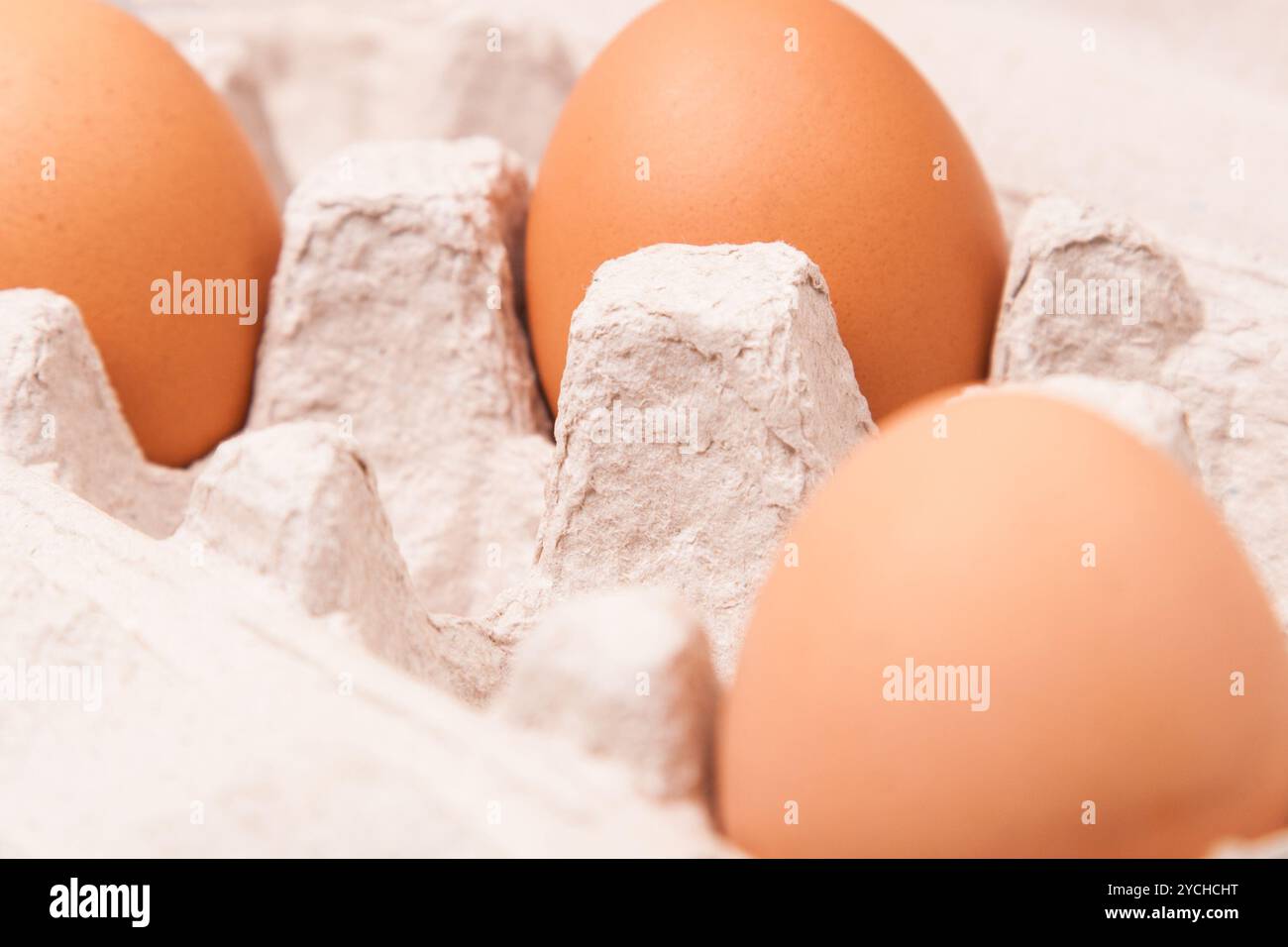 Fresh yellow chicken eggs in container Stock Photo - Alamy