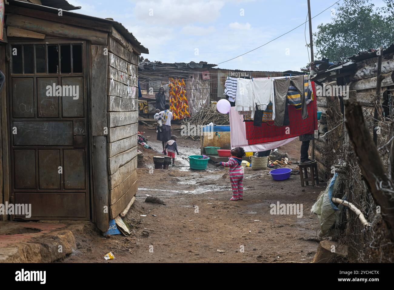 NAIROBI SLUM KIBERA, KENYA, AFRICA - NOVEMBER 18, 2022: Slum dwellers ...