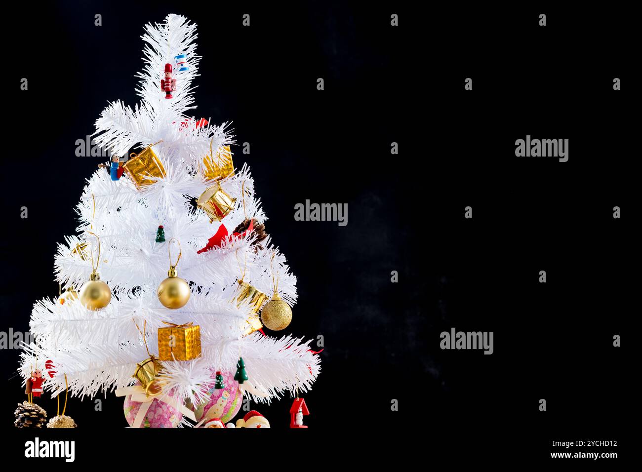 Small Christmas tree sitting on top of stool in a minimal room Stock ...