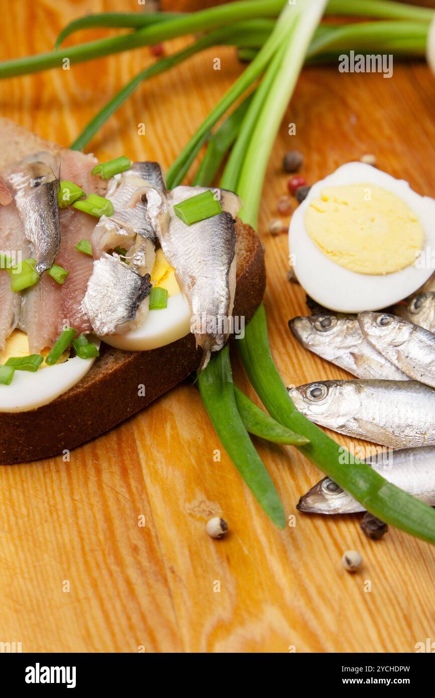 Sandwich from salted anchovies with egg and spring onion Stock Photo ...