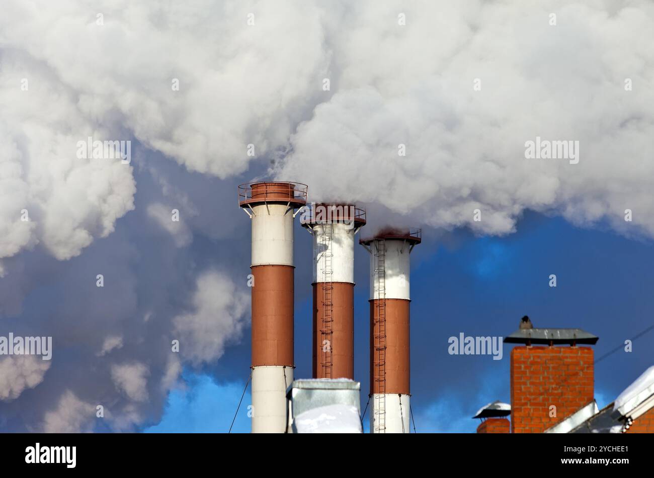 Smoking chimneys other blue sky Stock Photo - Alamy