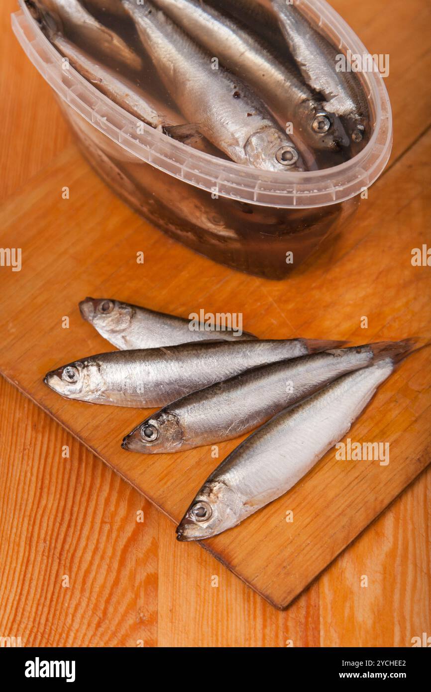 Salted anchovies in box on wooden Stock Photo - Alamy