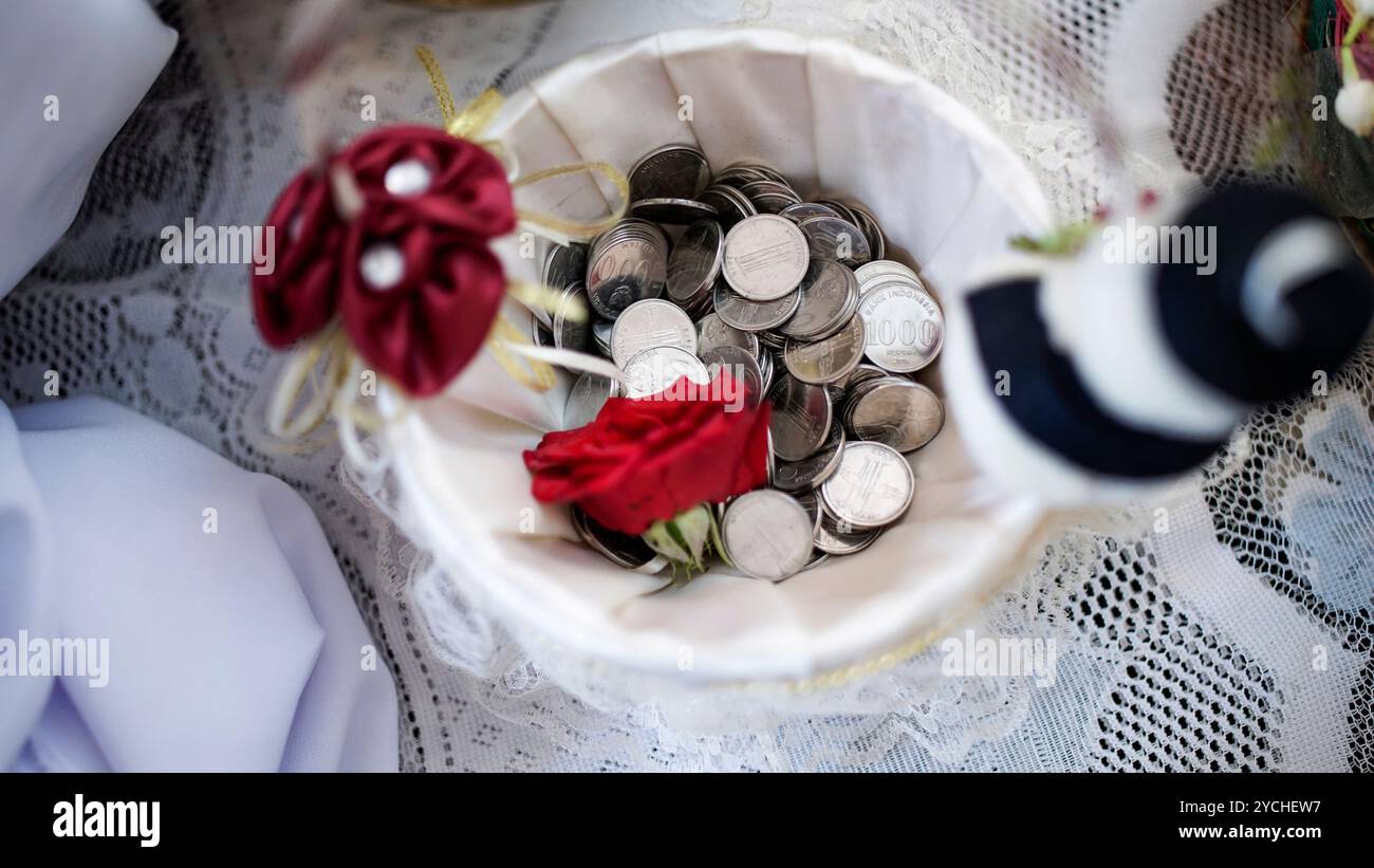 coins at the Siraman ceremony before the wedding ceremony Stock Photo ...