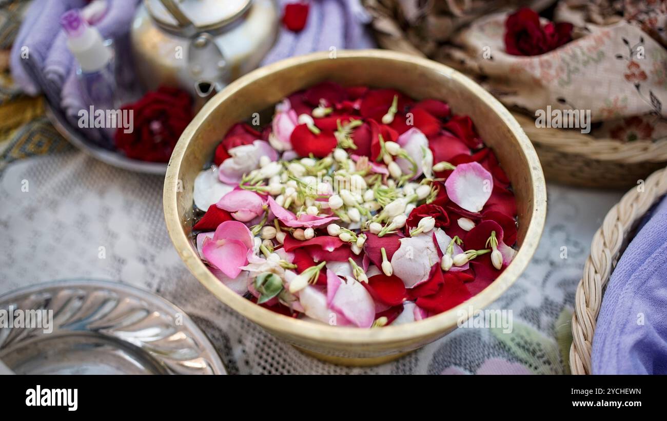 roses and jasmine in a bowl container during the splash ceremony before ...