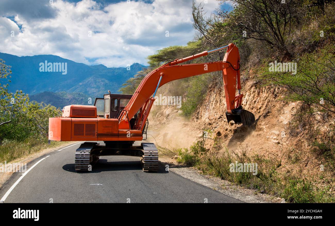 Excavator repair the road Stock Photo - Alamy